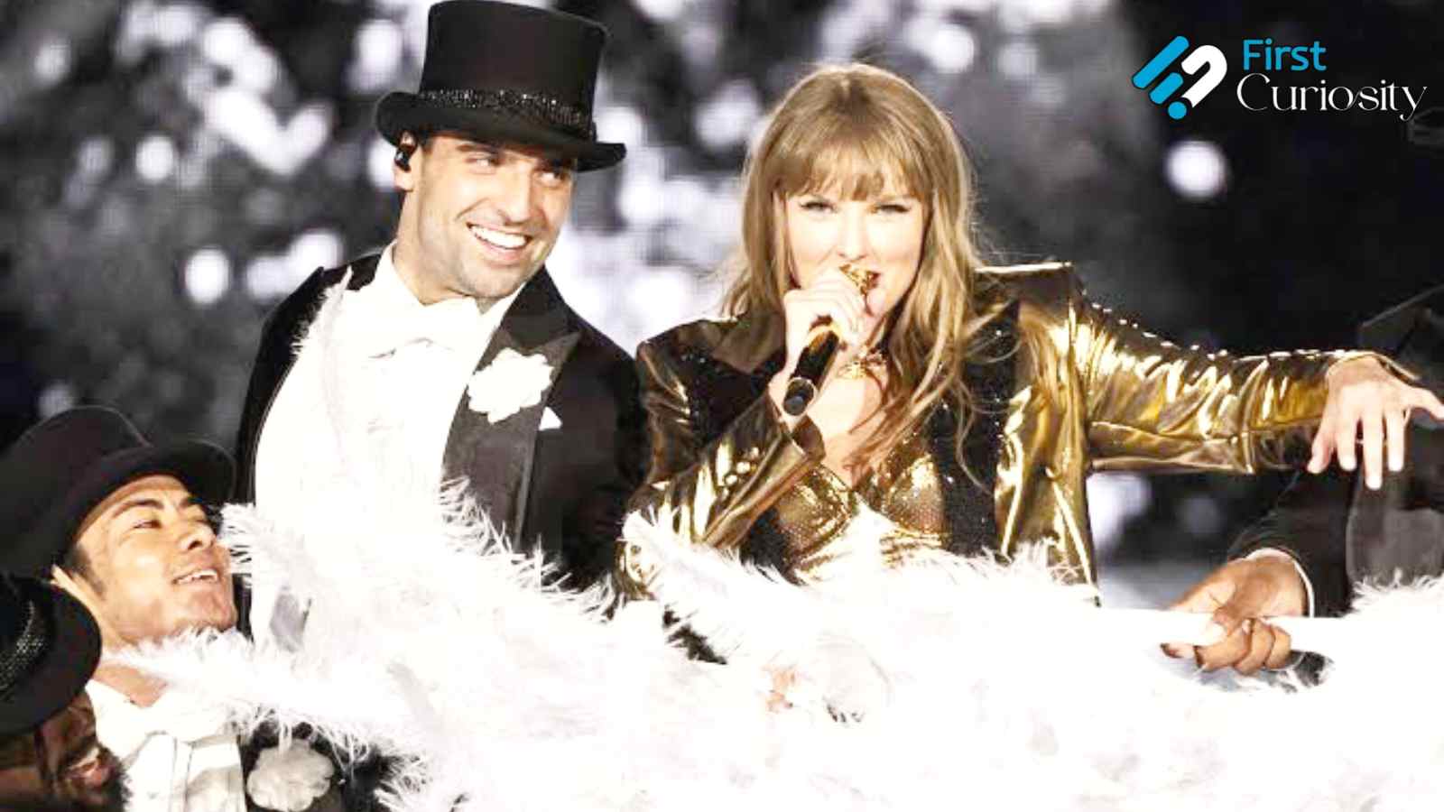 Watch: Taylor Swift's Dashing Back-Up Dancer Comes To The Rescue As She ...